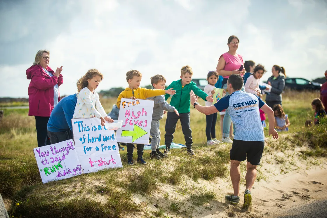 Huge crowds cheer on half marathon runners