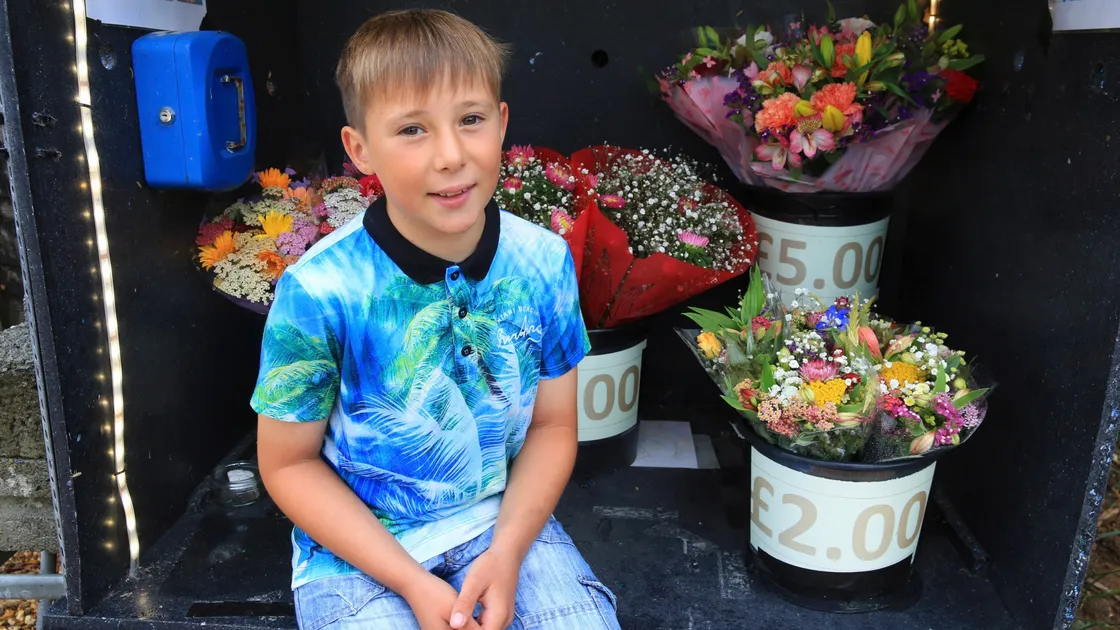 Samuel, 11, teams up with Co-op in flower stall idea