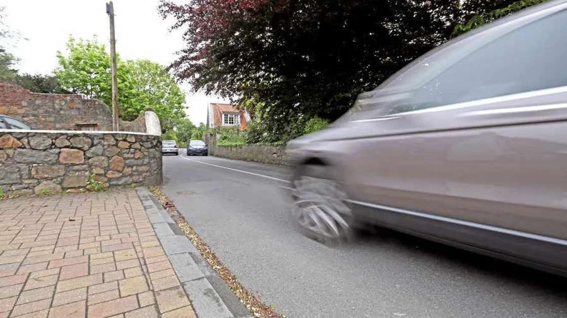 Rumble strips and pedestrian walkway to calm Friquet traffic