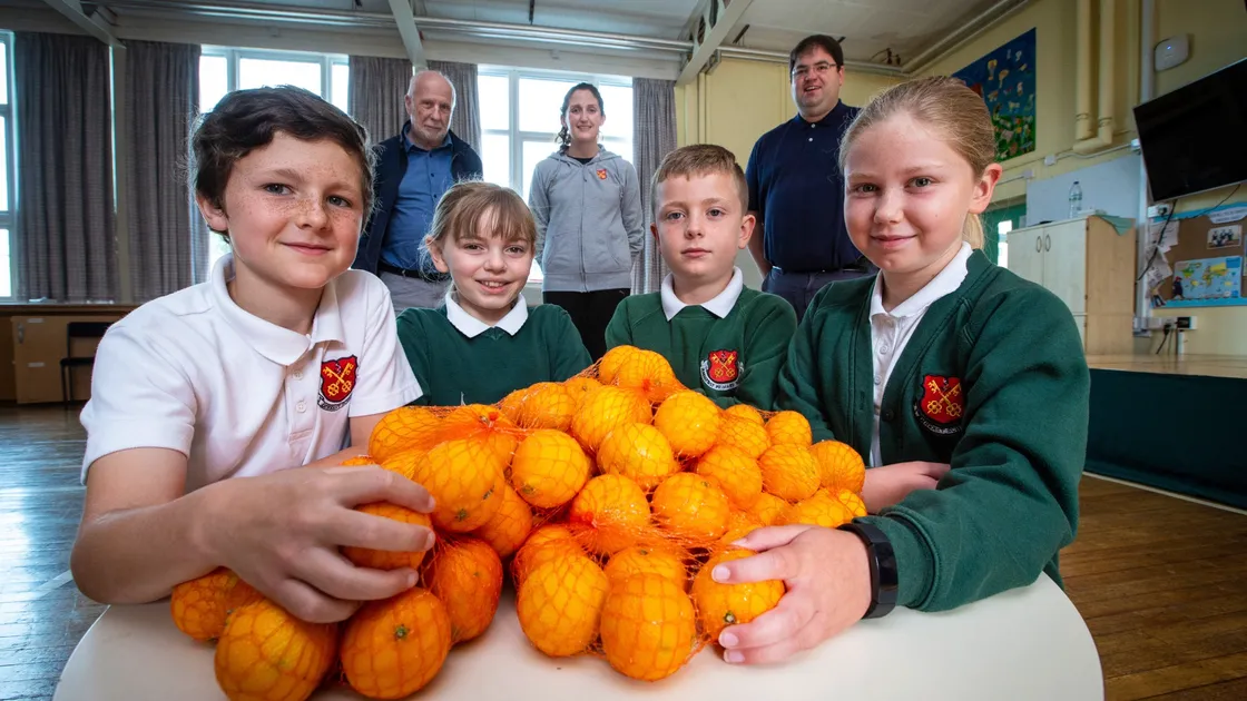 Les Cotils dishes out fruit for pupils