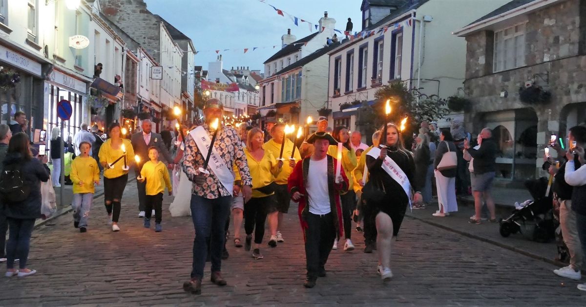 Torchlight procession ends a successful Alderney Week