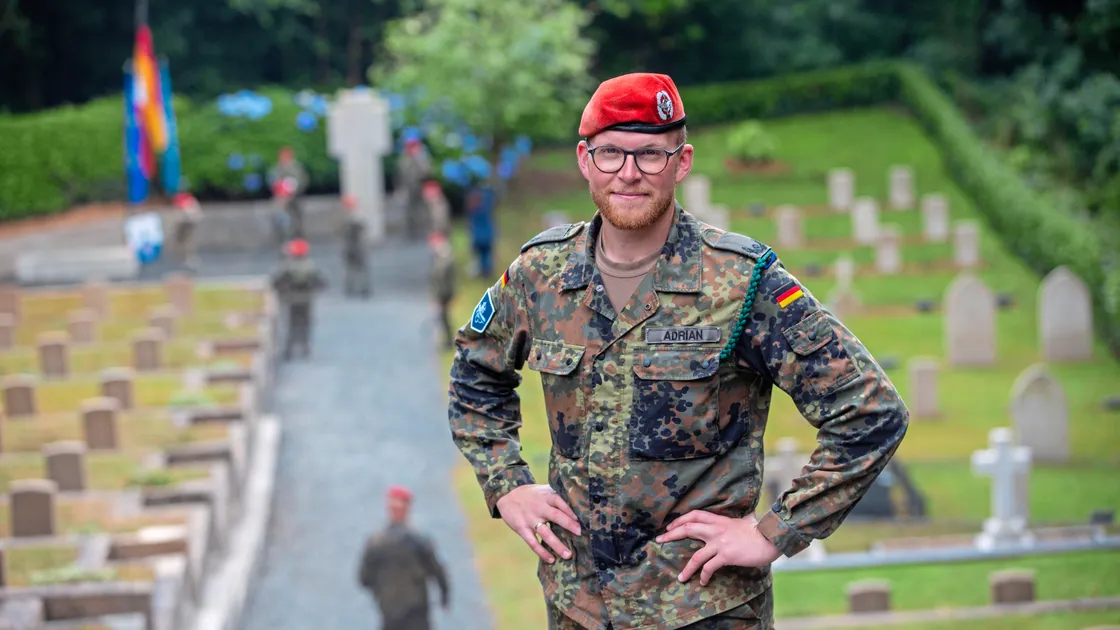 German soldiers clean Fort George Military Cemetery war graves